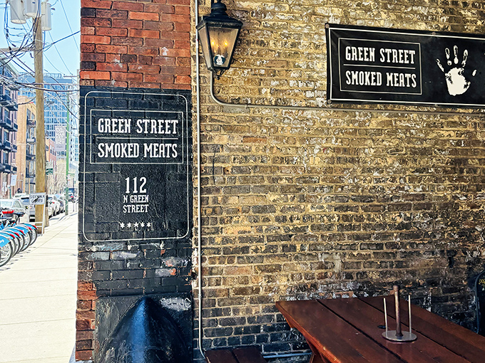 The rustic cobblestone courtyard outside Green Street Smoked Meats sets the stage for a meat adventure that feels deliciously clandestine.