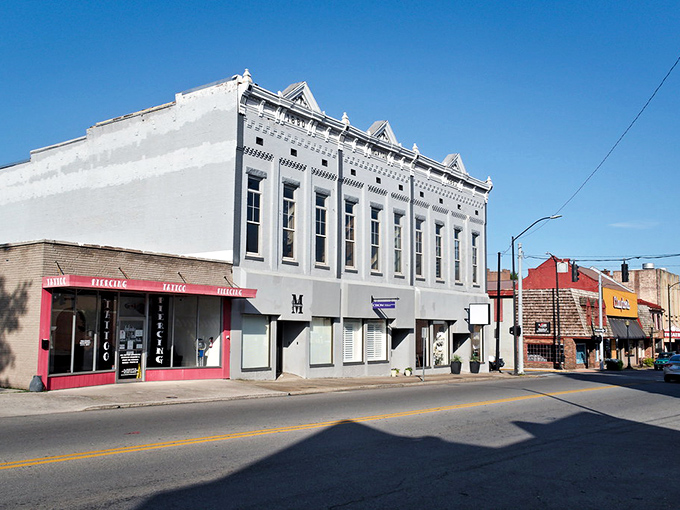 This white Victorian building commands attention like a Southern belle who knows how to stretch every penny.