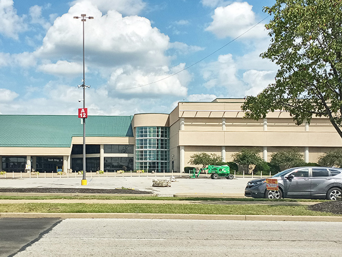 Modern architecture houses timeless traditions, proving flea markets can wear contemporary clothes while keeping their vintage soul.