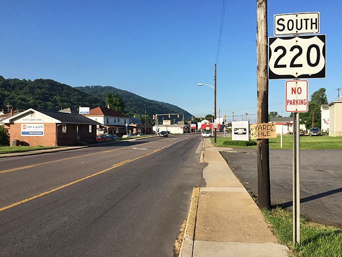 Route 220 stretches toward Keyser's green mountain guardian, where the asphalt ribbon seems to say, "Slow down, you're almost home."