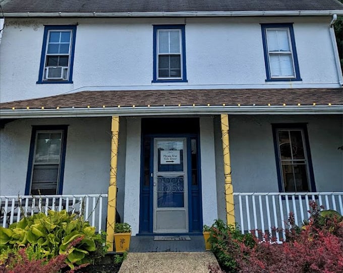 The welcoming porch at Lettie's sets the stage for what's inside: comfort food that feels like a warm hug for your taste buds.