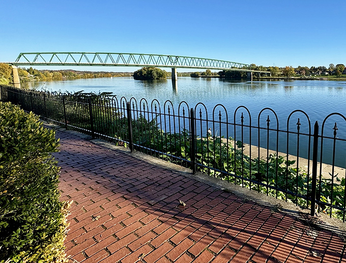 The bridge spans the water like a gentle handshake between communities, connecting hearts and histories.