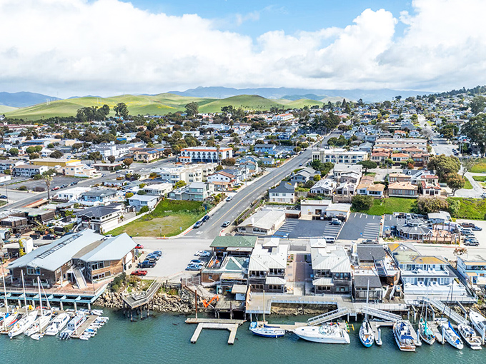 Waterfront living meets working harbor charm where colorful buildings line the Embarcadero along the protected estuary.