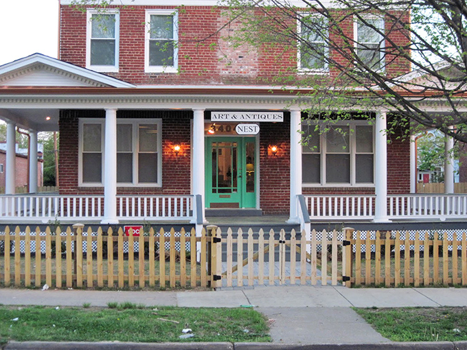 That inviting green door opens to curated treasures where every piece earns its display space.