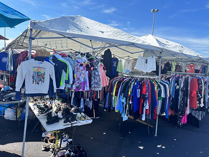 Rows of colorful clothing dance in the breeze, creating a rainbow of possibilities under stadium lights.