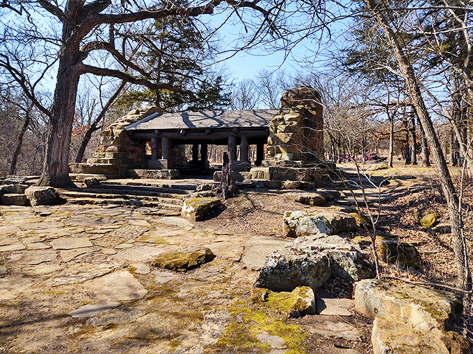 Historic stone lodge nestled among trees feels like discovering Grandpa's secret fishing cabin paradise.