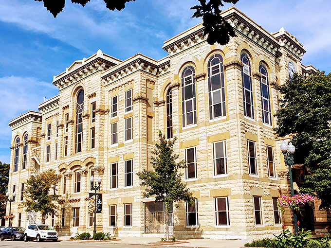 The warm limestone facade of Ottawa's historic courthouse glows in the sunlight, a monument to small-town civic pride.