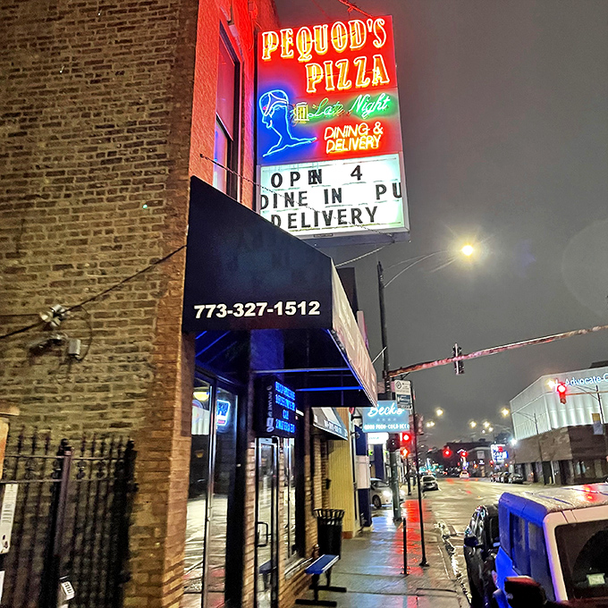 By night, Pequod's neon sign glows like the North Star for pizza explorers seeking caramelized crust perfection.