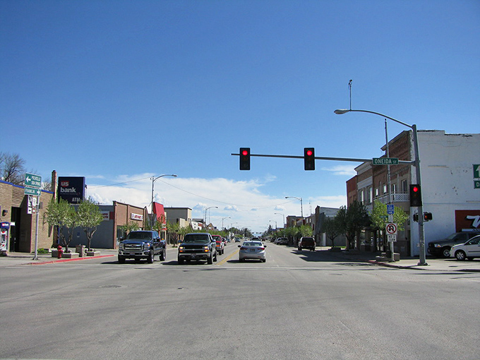 Small-town charm meets open skies on a quiet main street where everyday life rolls by at an easy pace.