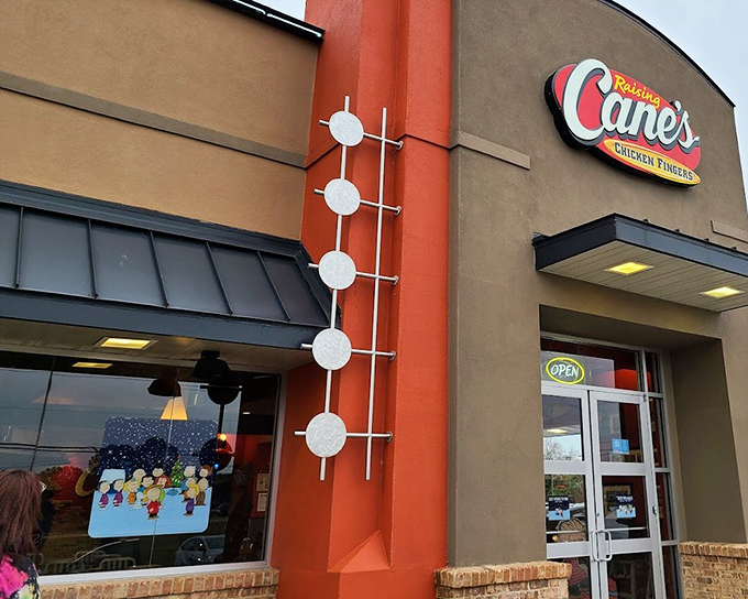 That distinctive red accent isn't just branding &ndash; it's a warning sign that addictively good chicken fingers lie ahead.