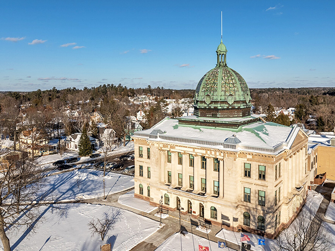 The impressive green-domed courthouse stands as Rhinelander's crown jewel, surrounded by neighborhoods where homes sell for well below national averages.