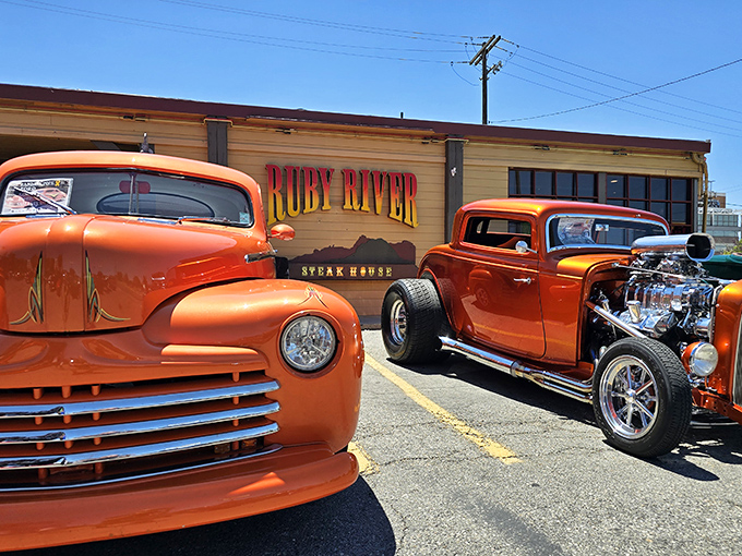 Ruby River's sign glows like a neon promise. Where hot rods and hot steaks create the perfect American pairing.