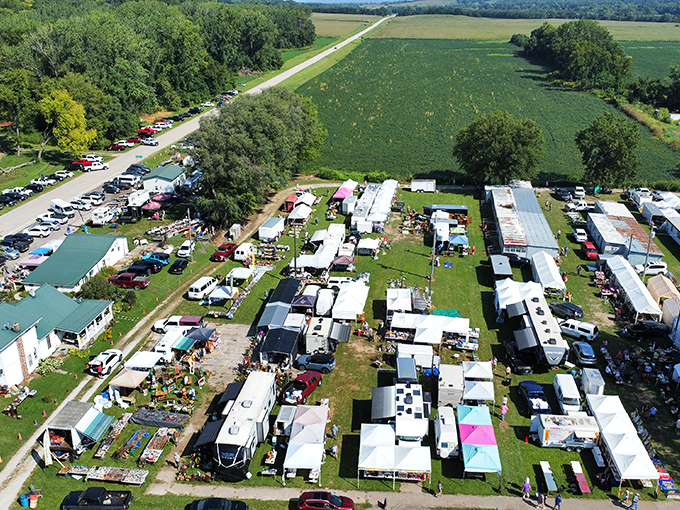 The aerial view reveals the organized chaos that makes flea markets magical - every booth a potential treasure chest waiting to be explored.