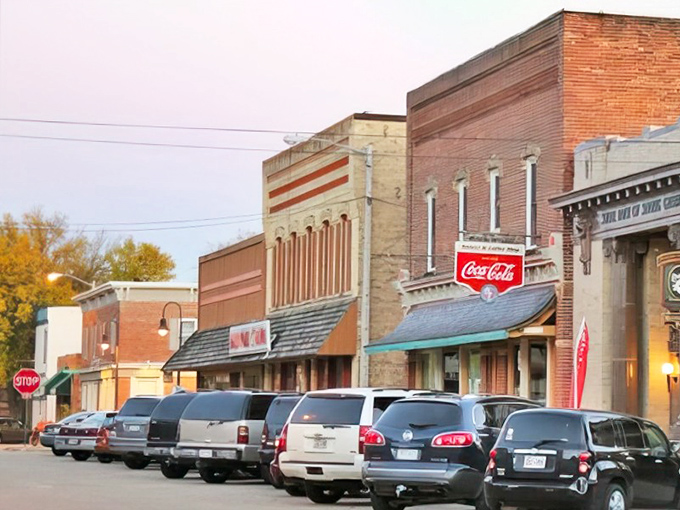 Coca-Cola signs and classic lines! Spring Green's brick-front beauties stand guard over parked SUVs like architectural time capsules waiting for their Hallmark movie moment.