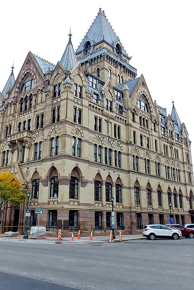 The magnificent cathedral spires reach skyward like prayers made visible, dominating the cityscape with spiritual majesty and grace.