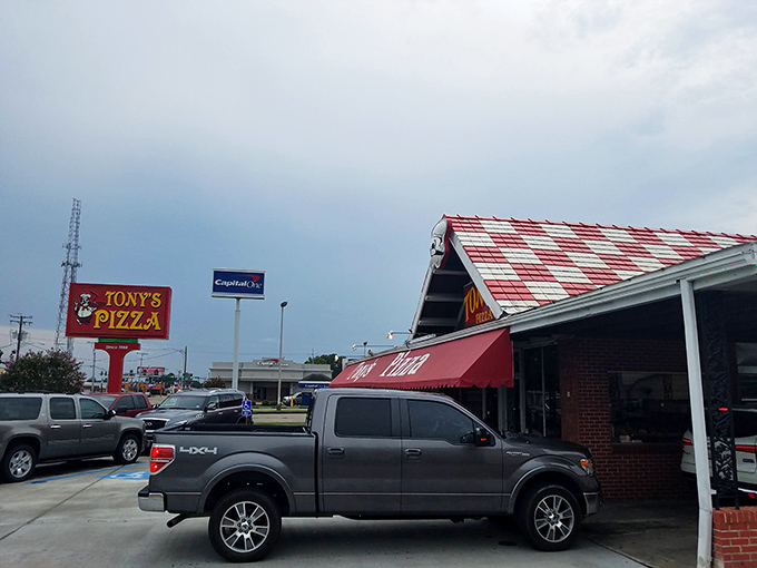 The iconic red awning at Tony's signals your search for the perfect slice is over – park the car and prepare for bliss.