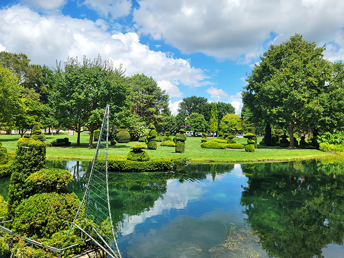 The reflecting pond doubles the impact of Columbus' remarkable topiary garden, creating a serene green masterpiece.