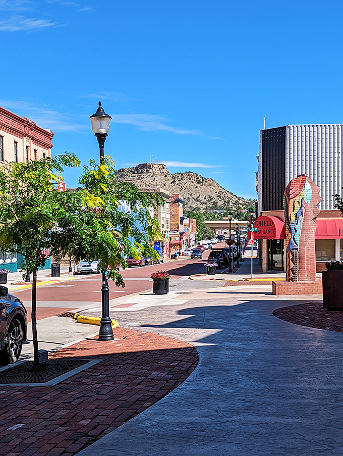 Modern red sculptures add artistic flair to a downtown square where culture costs nothing extra.