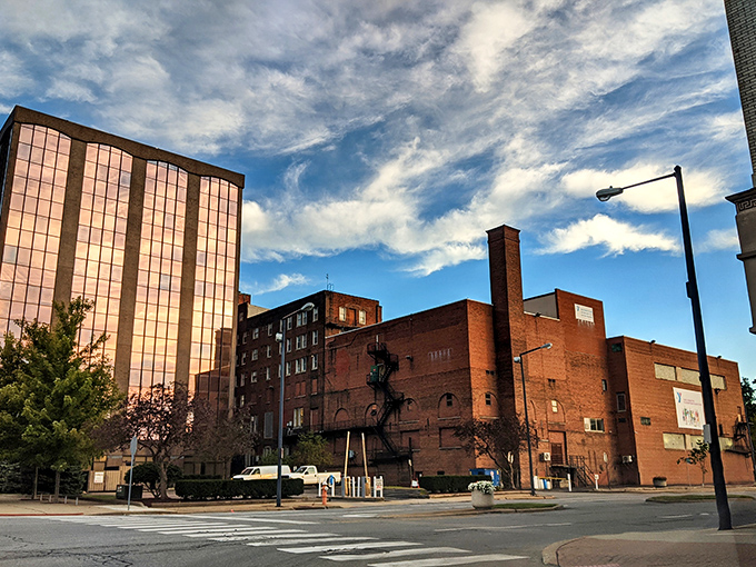 The heart of Youngstown blends old and new, where red brick charm meets bright reflections under a perfect Ohio sky.