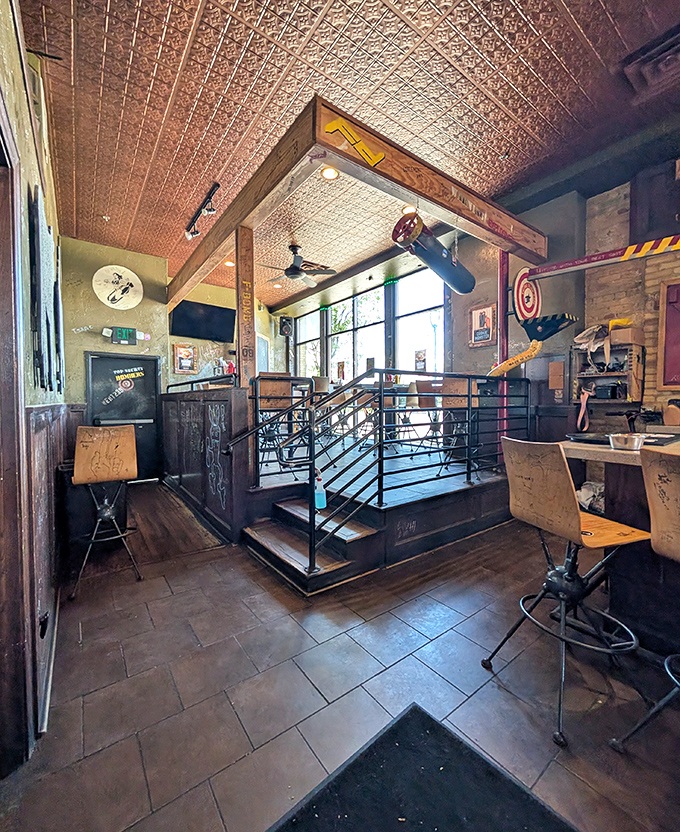 Step inside and discover a world where industrial-chic meets playful nostalgia, complete with tin ceilings and those famous peanut delivery tracks overhead.