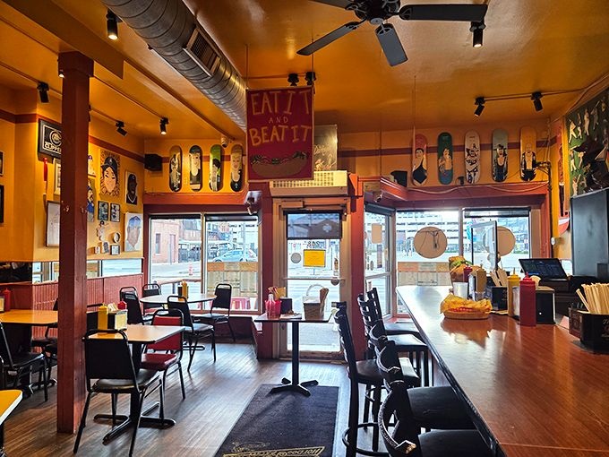 Skateboard decks and pop culture art transform this cozy space into a temple of tubular meat worship. The "Eat It and Beat It" sign isn't rushing you&mdash;it's a challenge. 