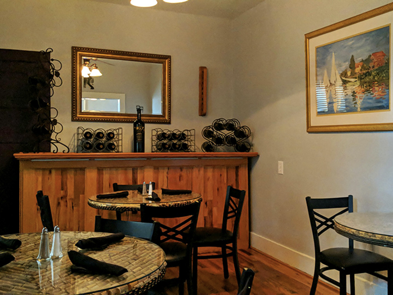 Intimate dining spaces with warm wooden accents and tasteful decor create the perfect backdrop for memorable meals and conversation.