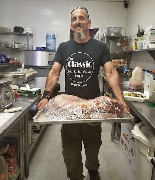 Behind every great meal is someone who knows exactly what they're doing. That smile says, "Just wait until you taste what's under this wrap."