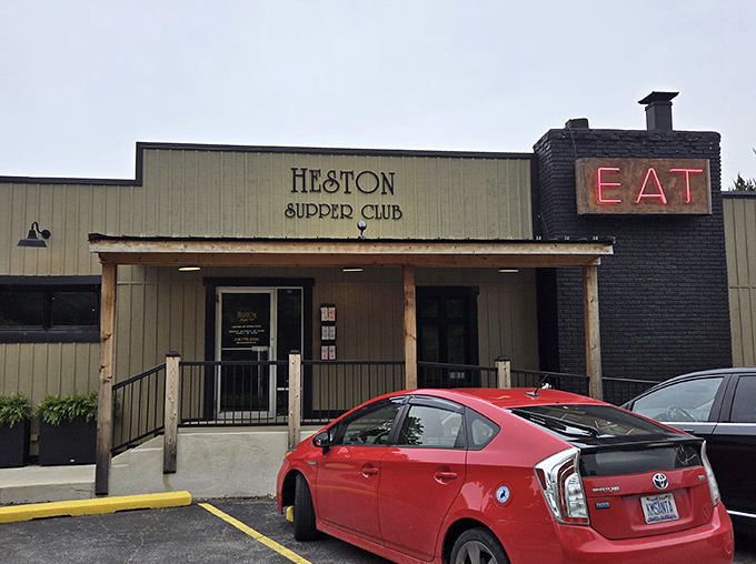 The iconic "EAT" sign glows like a beacon of culinary hope against the brick facade, a siren call to hungry travelers on Indiana's backroads.