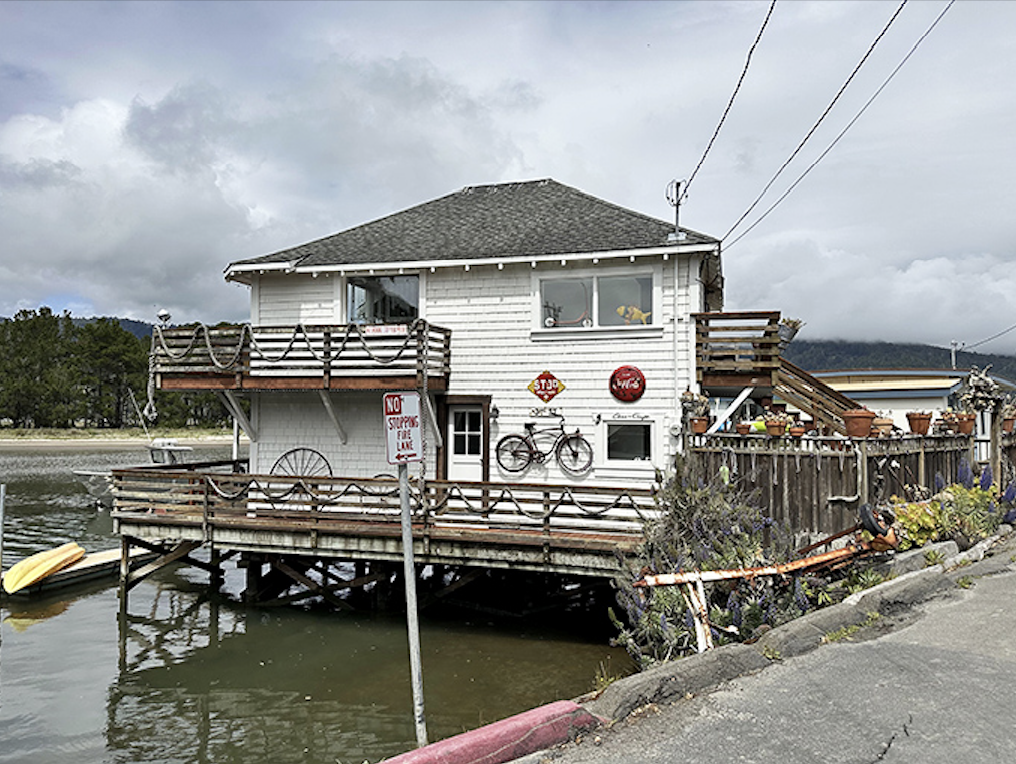The Bolinas Rod & Boat Club stands on stilts like a watchful heron – half on land, half on water, completely captivating.