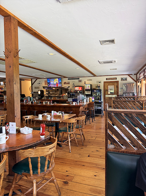 Where breakfast dreams come true! A bustling dining room with wooden tables, chairs that have supported thousands of happy bottoms, and the promise of maple-scented memories.