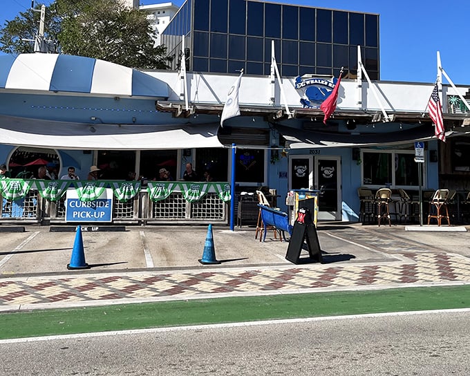 The blue and white exterior of The Whale's Rib stands like a maritime mirage on Deerfield Beach, complete with a boat hull that seems to have crashed into the building decades ago.