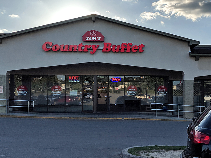 The red signage of Sam's Country Buffet beckons like a lighthouse for the hungry, promising comfort food salvation in an unassuming strip mall setting.