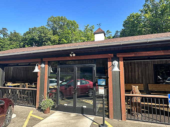 Nestled among Ohio's lush greenery, The Bear's Den's rustic exterior promises a woodland retreat where carnivorous adventures await hungry travelers.