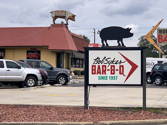 The iconic metal pig stands sentinel atop Bob Sykes, a beacon of barbecue hope that's been guiding hungry Alabamians home since Eisenhower was president.