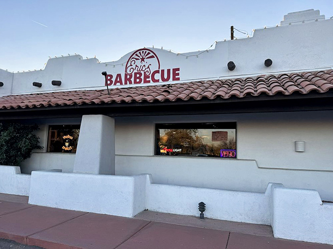 That distinctive white exterior with terracotta tiles and bold red signage promises serious barbecue awaits inside.