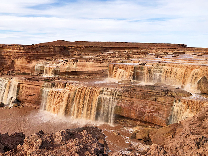Nature's tiered chocolate fountain puts any dessert buffet to shame. The layered cascades of Grand Falls create a mesmerizing display against Arizona's rust-colored landscape.
