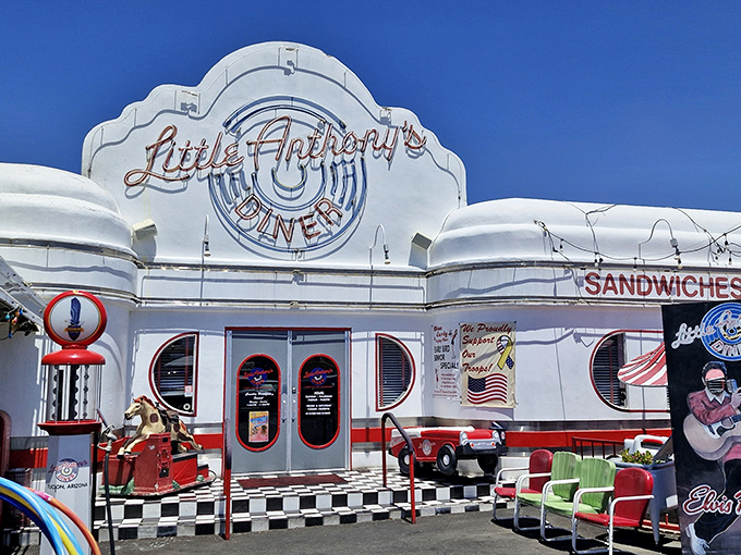 The white facade of Little Anthony's gleams like a time portal to the 1950s, complete with vintage cars that aren't just for show&mdash;they're setting the stage for your nostalgic feast.