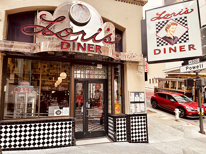 The iconic red neon sign of Lori's Diner glows like a beacon on Powell Street, promising a journey back to simpler times and satisfying meals.