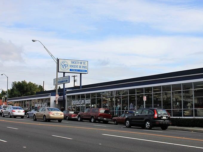 The blue-trimmed storefront stretches along the street like a retail oasis, promising treasures within that won't empty your wallet.