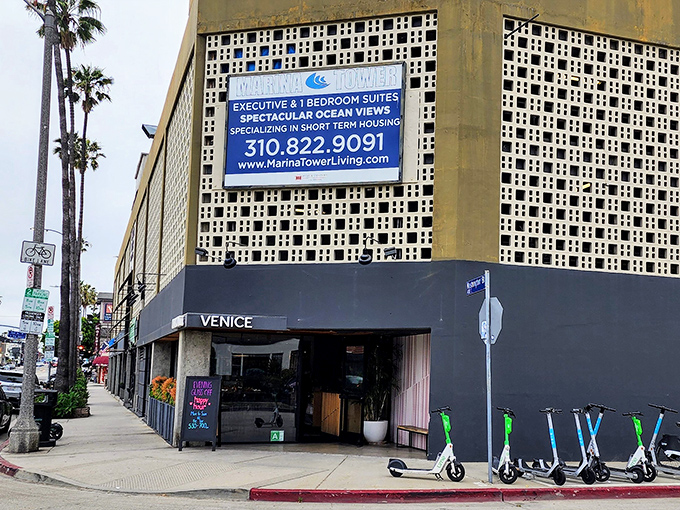 The unassuming exterior of Charcoal Venice stands like a culinary speakeasy, with electric scooters standing guard. Venice cool meets meat-lover's paradise.