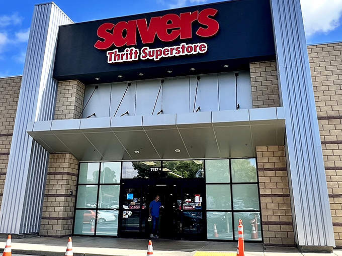 The iconic red Savers sign beckons like a lighthouse to bargain hunters navigating the sea of retail mediocrity.