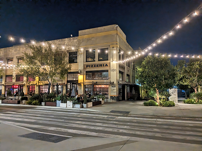 String lights dance above this DTLA gem, transforming an ordinary corner into a beacon for pizza pilgrims seeking transcendent pies after sunset.