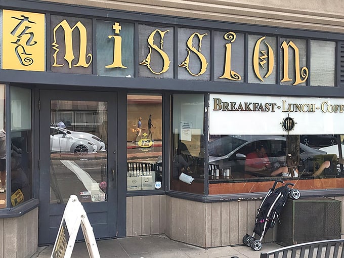 The Mission's unassuming white exterior with signature yellow signage belies the extraordinary breakfast experience waiting inside this San Diego gem.