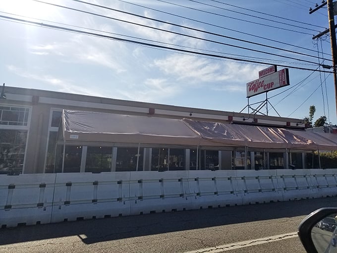 The unassuming exterior of Coffee Cup Cafe stands like a breakfast beacon on Long Beach's 4th Street, promising deliciousness without pretense.