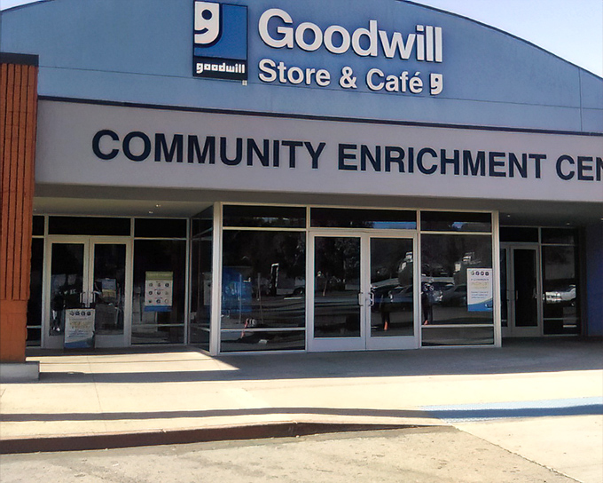 The blue facade of Goodwill's Community Enrichment Center stands ready to welcome treasure hunters into a world where one person's castoffs become another's discoveries.
