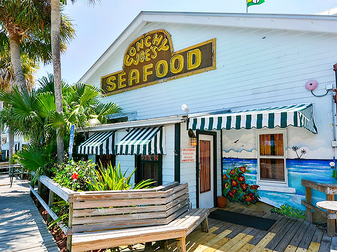 That iconic yellow and white sign beckons like a lighthouse for hungry seafood lovers. Old Florida charm with a side of sunshine.