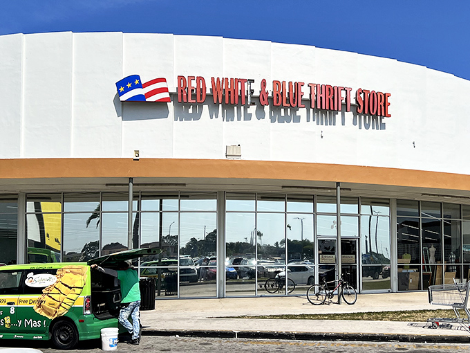 The patriotic facade of Red White & Blue Thrift Store stands proudly against the Florida sky, a temple of treasures waiting to be discovered by savvy shoppers.