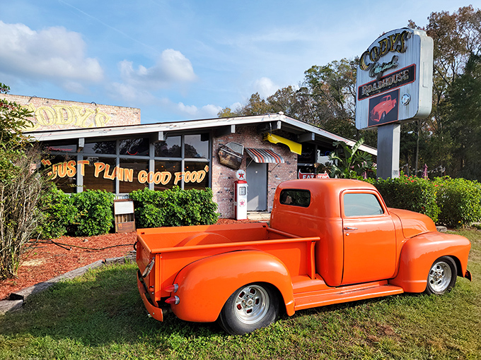 That vintage orange pickup isn't just decoration&mdash;it's a promise of the no-nonsense, flavor-packed experience waiting inside Cody's Original Roadhouse.