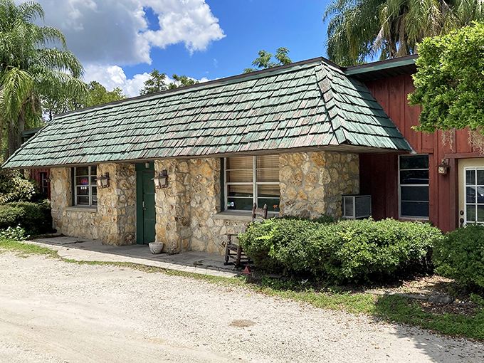 The classic stone-and-timber facade feels like discovering a secret mountain lodge in central Florida. Palm trees and rustic charm create an unexpected but delightful contrast.