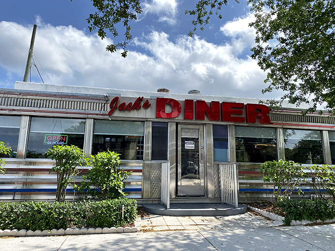 The iconic red sign of Jack's Diner gleams under Florida sunshine, welcoming hungry visitors to this Hollywood landmark.